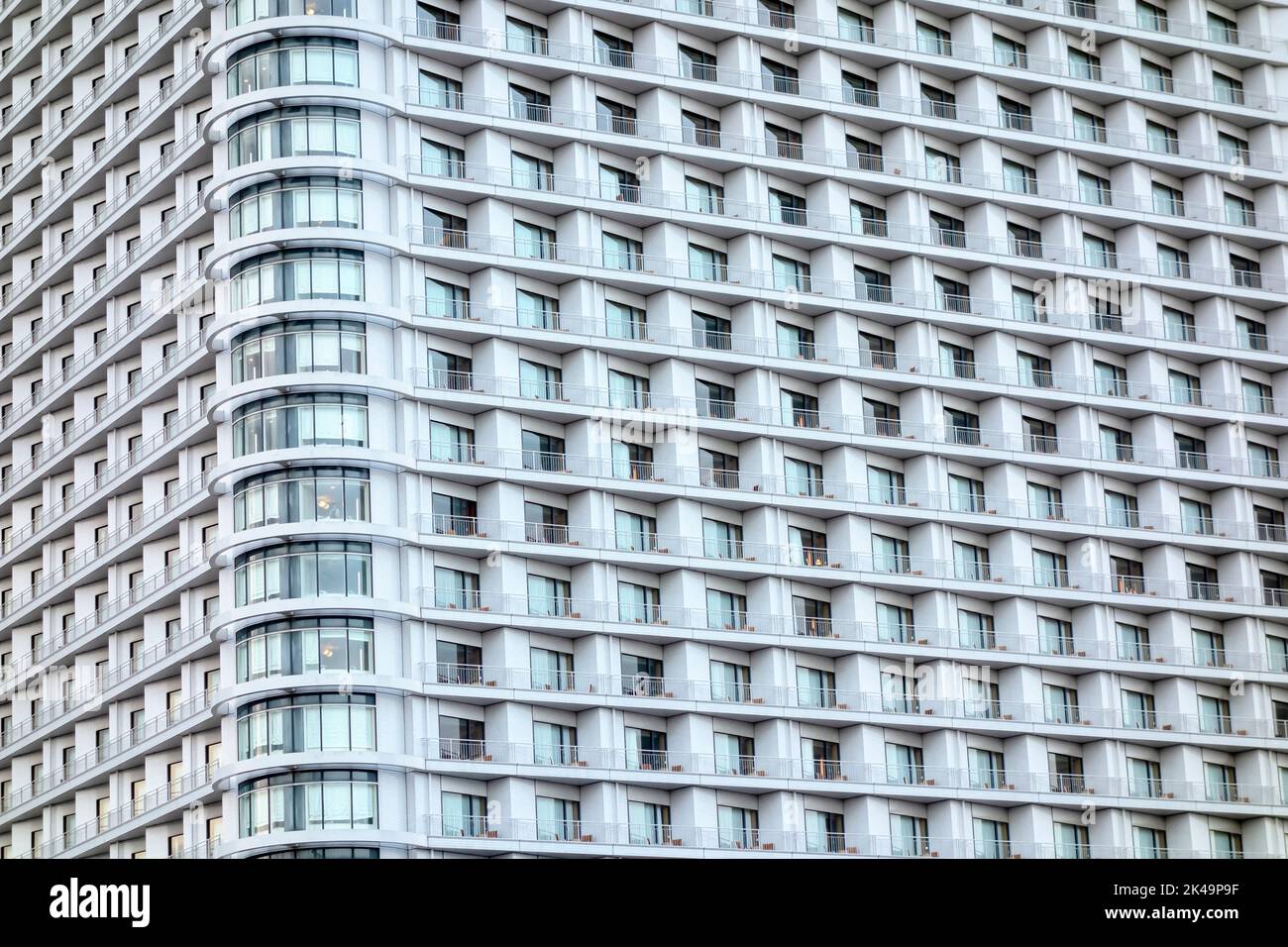 Facade of a tall grey hotel building - city building background Stock ...