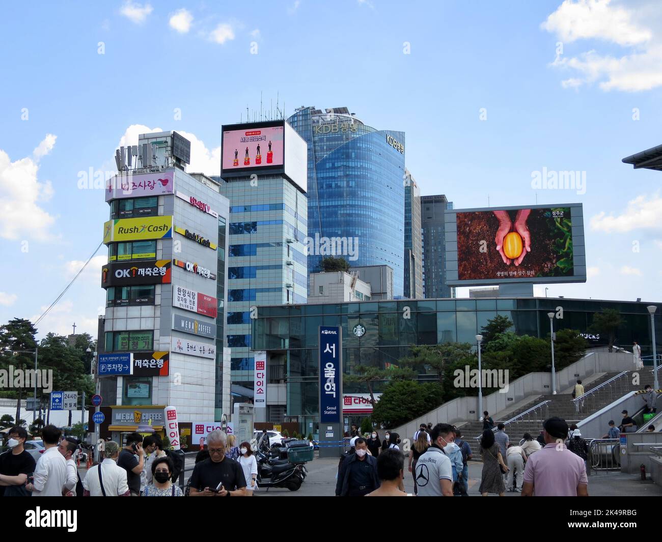 A beautiful View of buildings in Sejong-daero with people in the street ...
