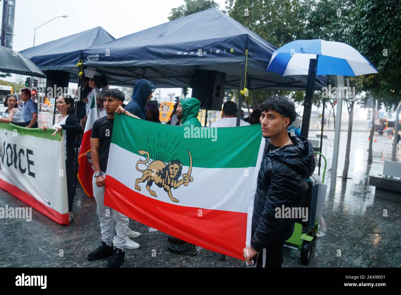 Protesters carry placards and banners during a rally calling for ...