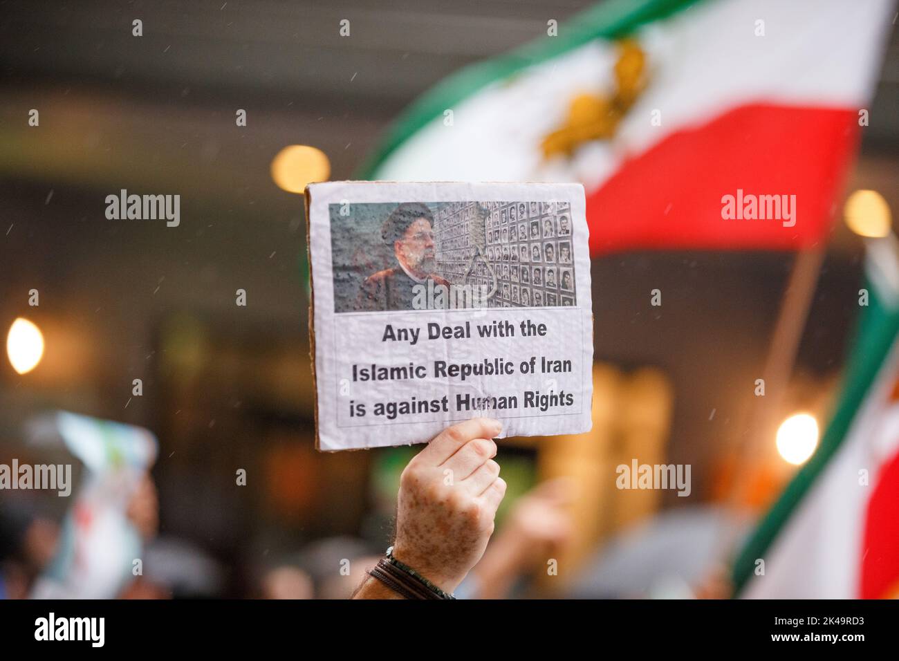 Protesters carry placards and banners during a rally calling for ...