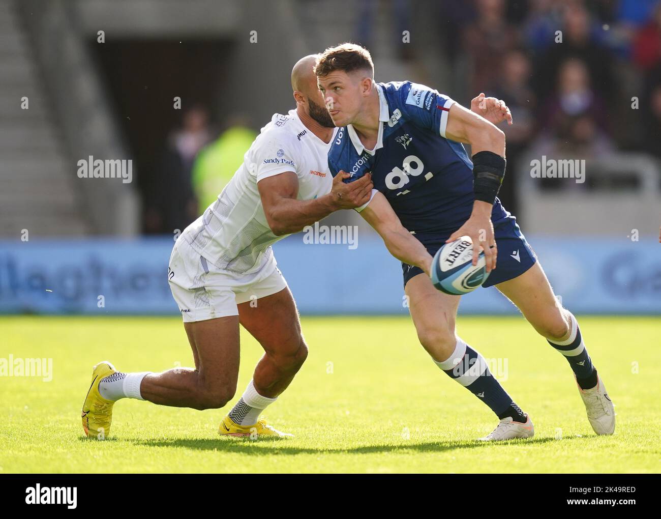 Sale Sharks Sam James is tackled by Exeter Chiefs Olly Woodburn during ...