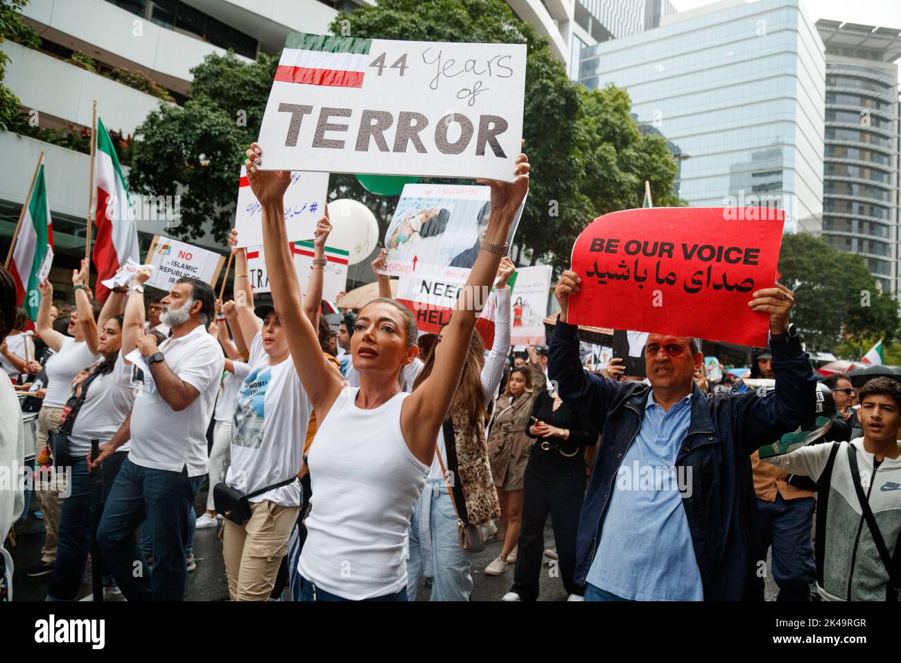 Protesters carry placards and banners during a rally calling for ...