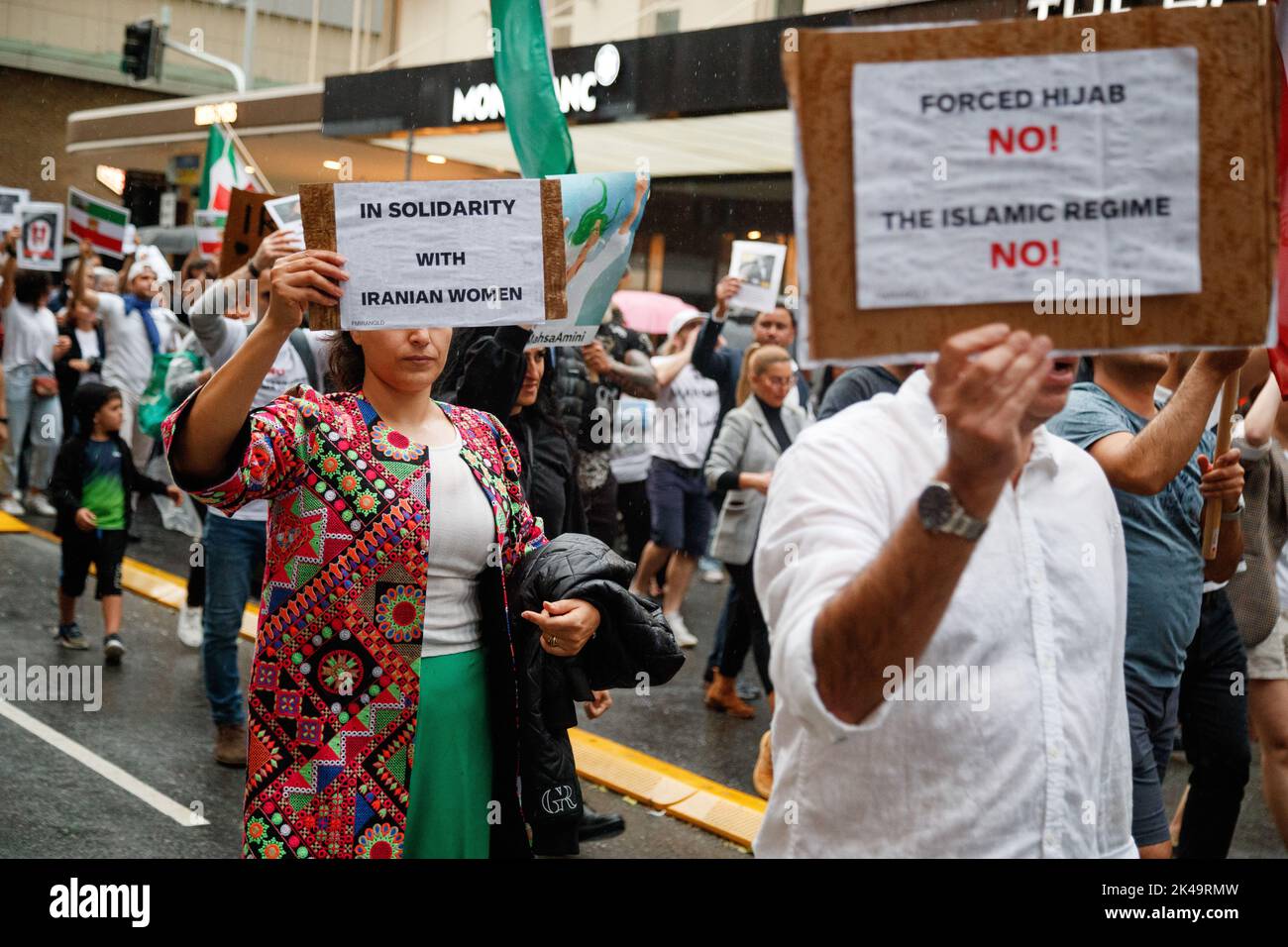 Protesters carry placards and banners during a rally calling for ...