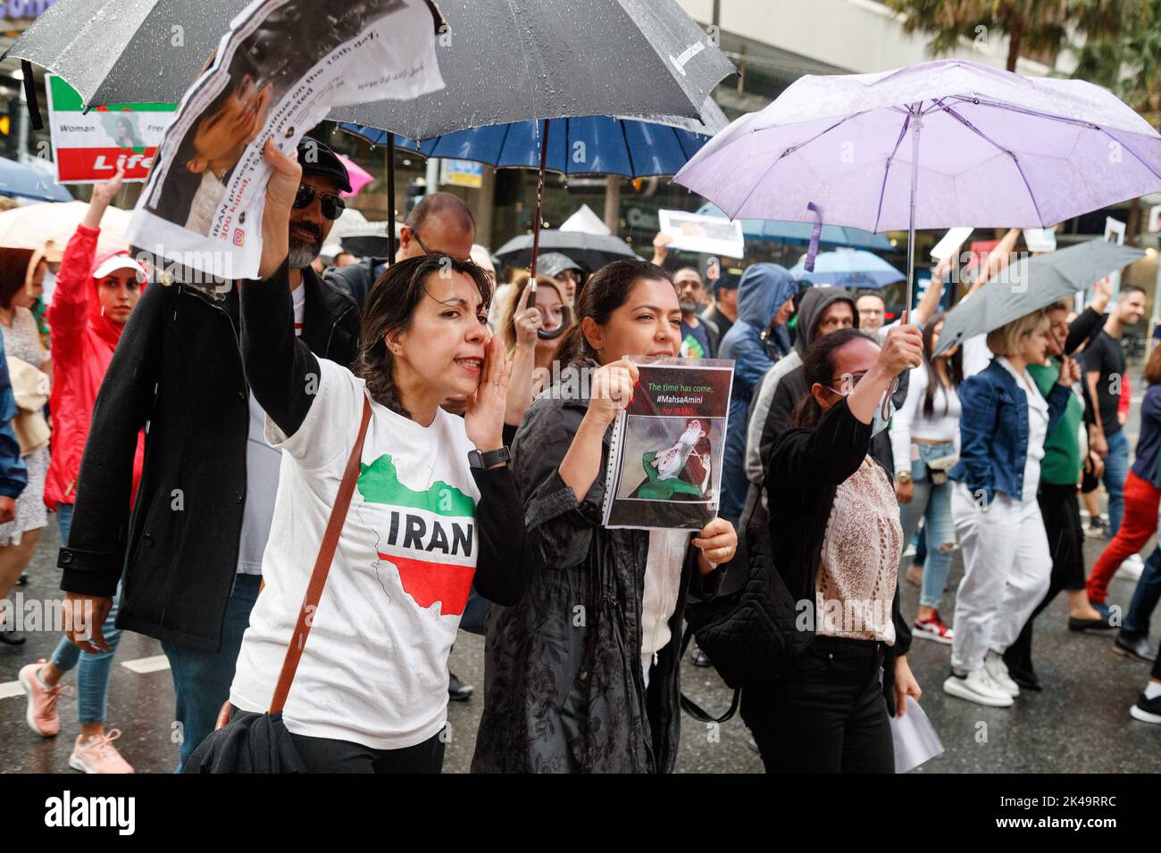 Protesters carry placards and banners during a rally calling for ...