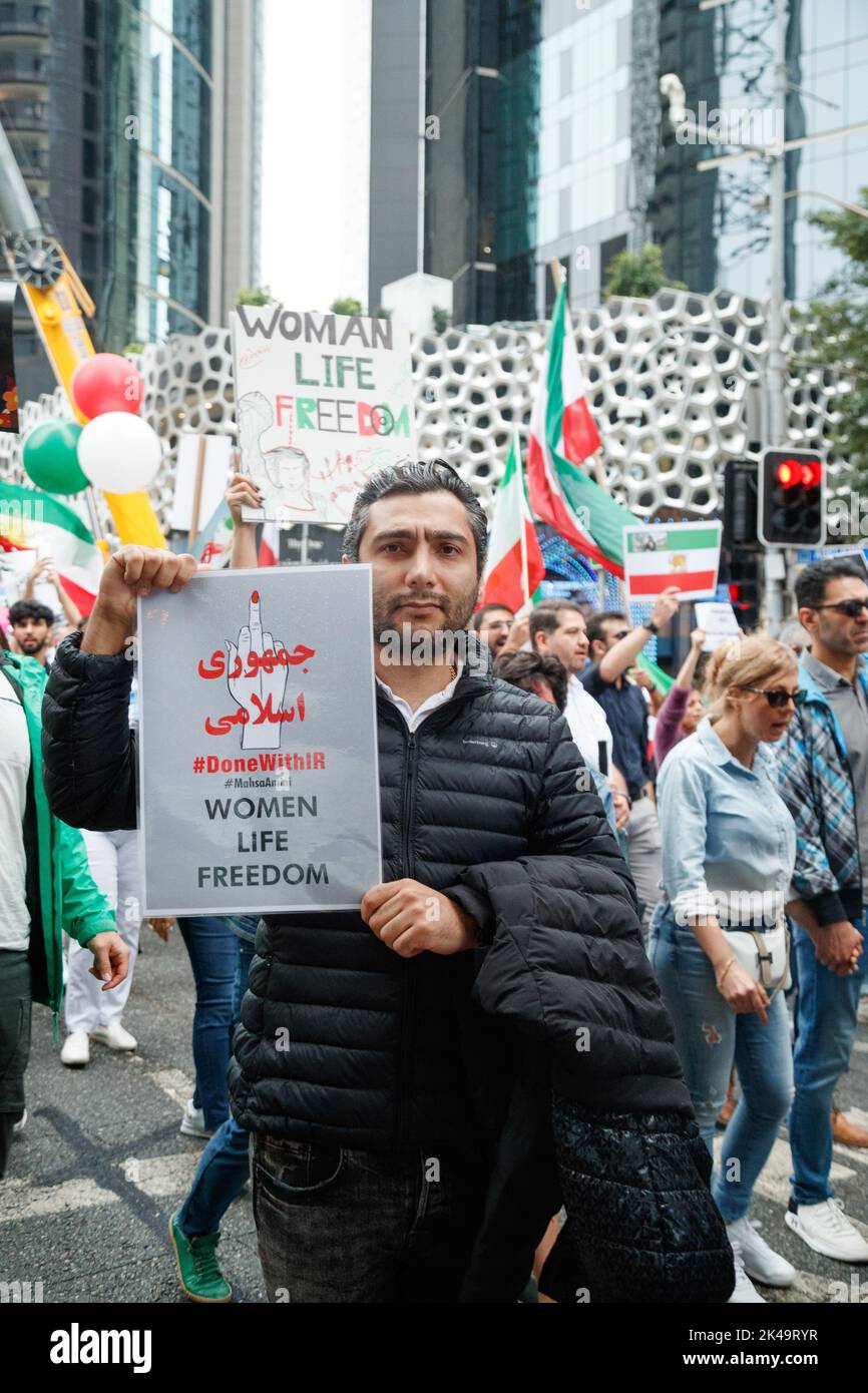 Protesters carry placards and banners during a rally calling for ...