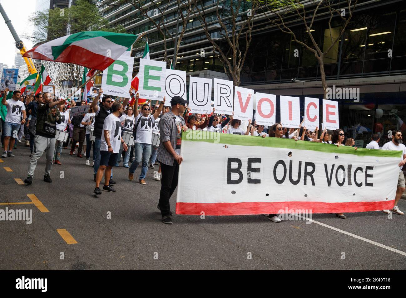 Protesters carry placards and banners during a rally calling for ...