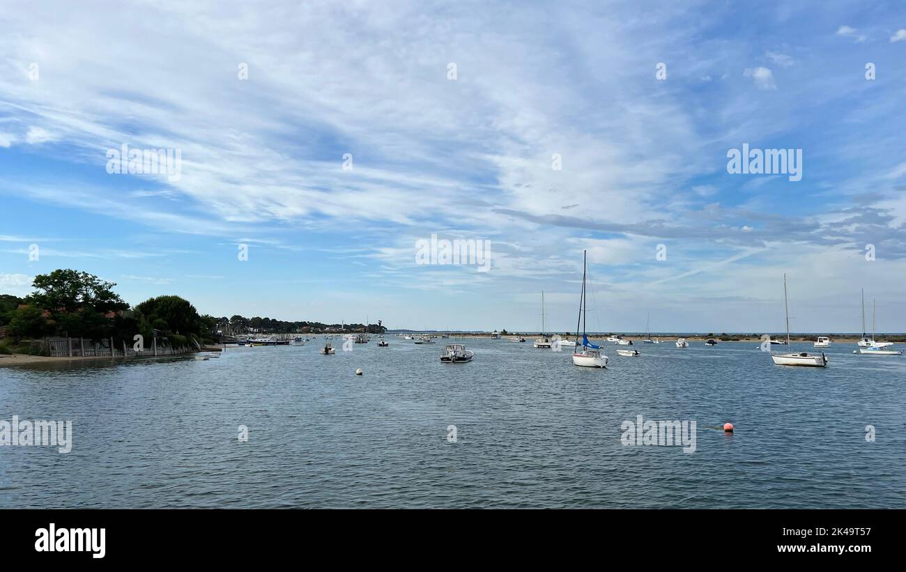 The boats in the calm lake against a cloudy sky Stock Photo - Alamy