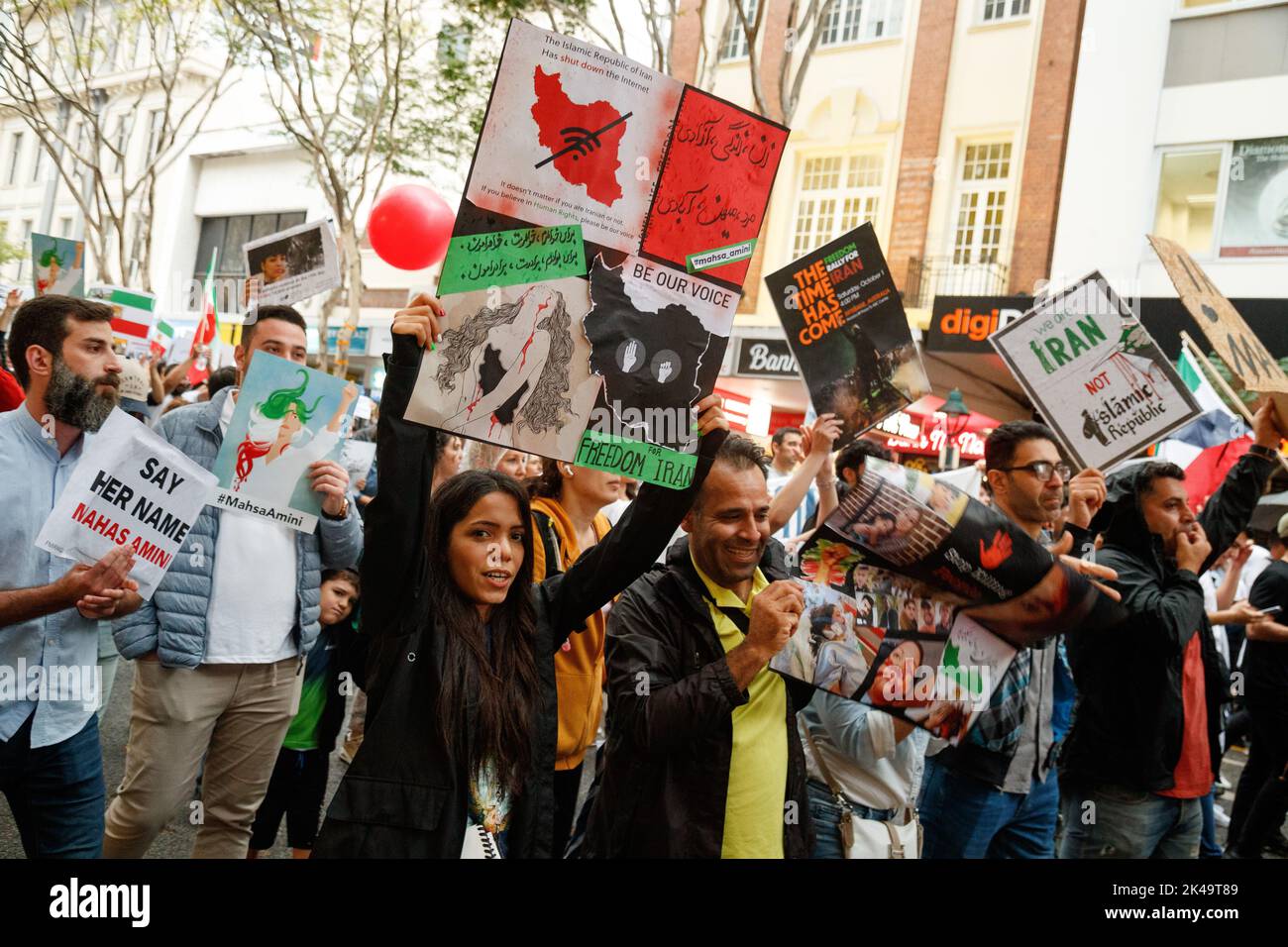 Protesters carry placards and banners during a rally calling for ...