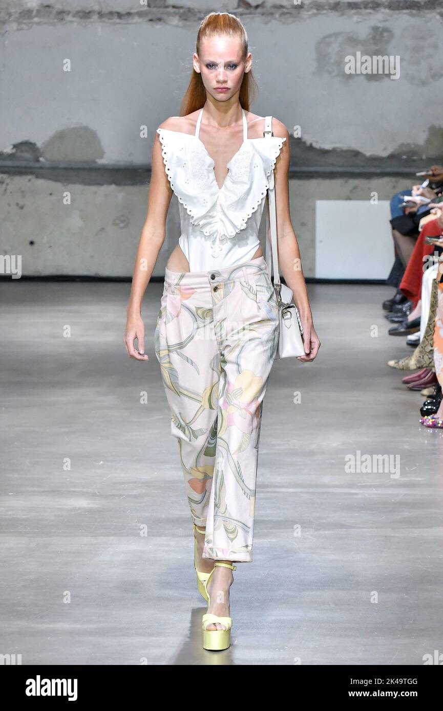 A model walks on the runway at the Leonard fashion show during the ...