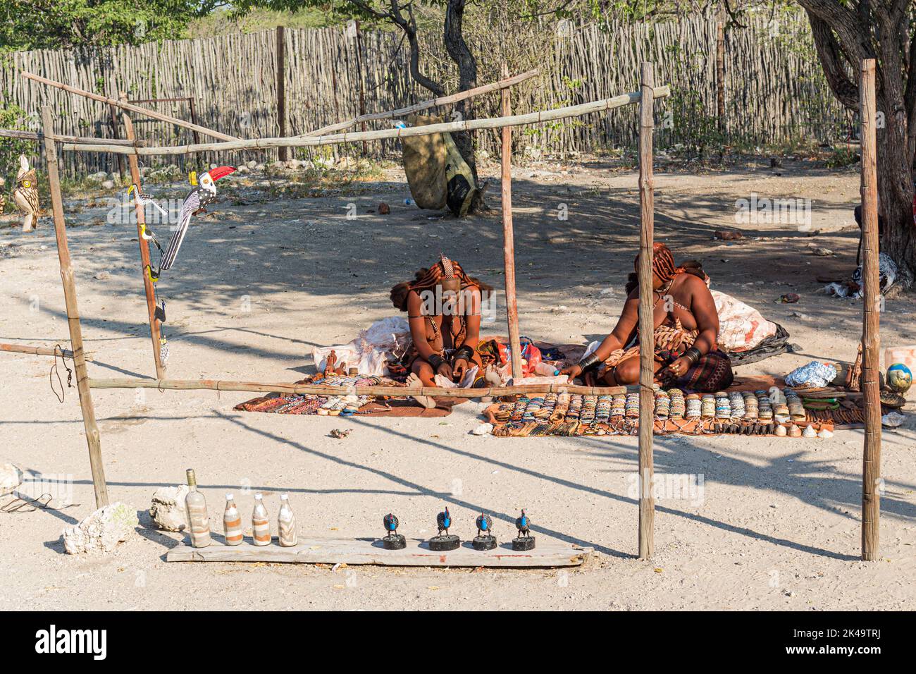 Himba Tribeswomen setting up their stall outside the gates to the ...