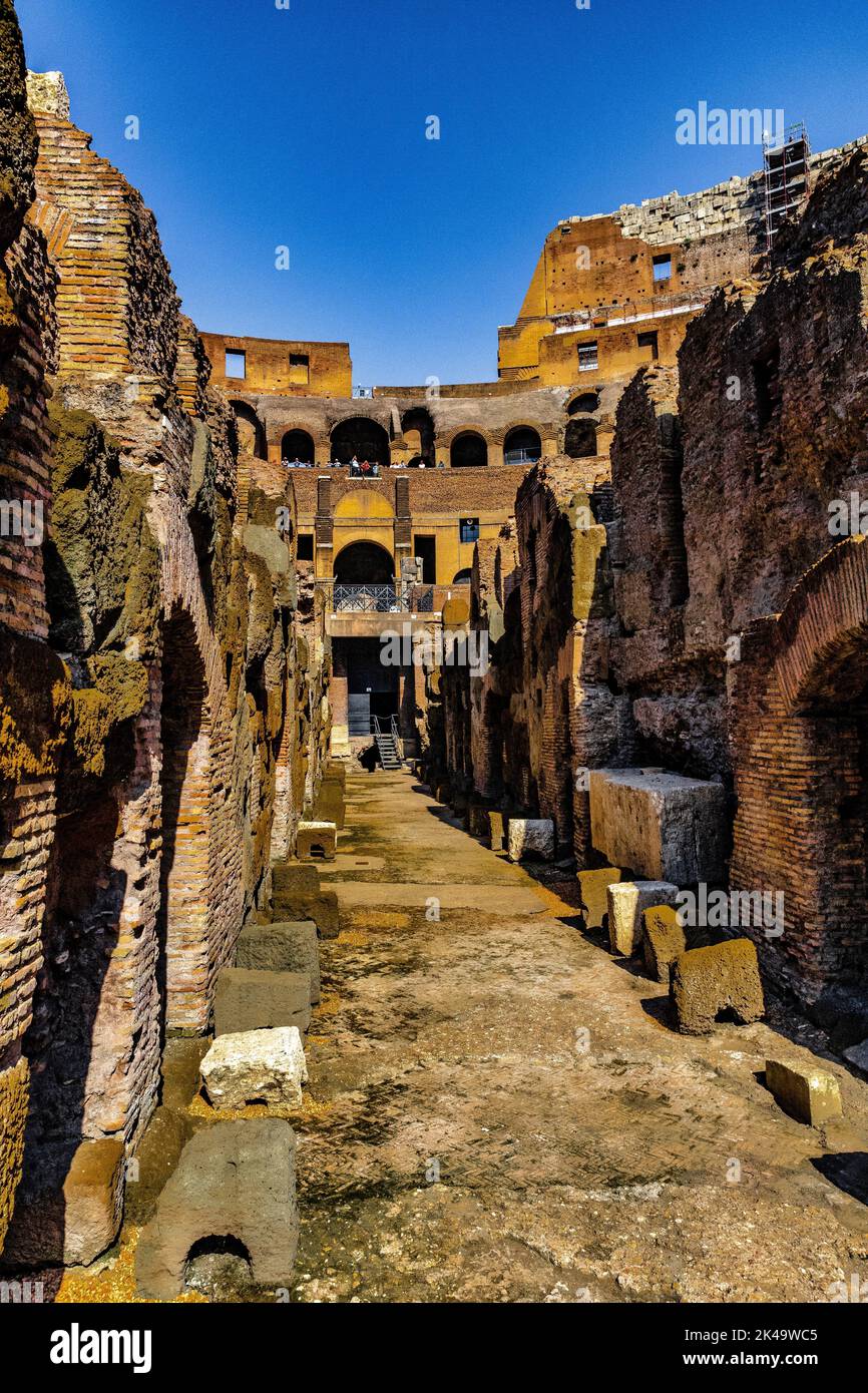 A vertical shot of Colosseum underground ruins against the background ...