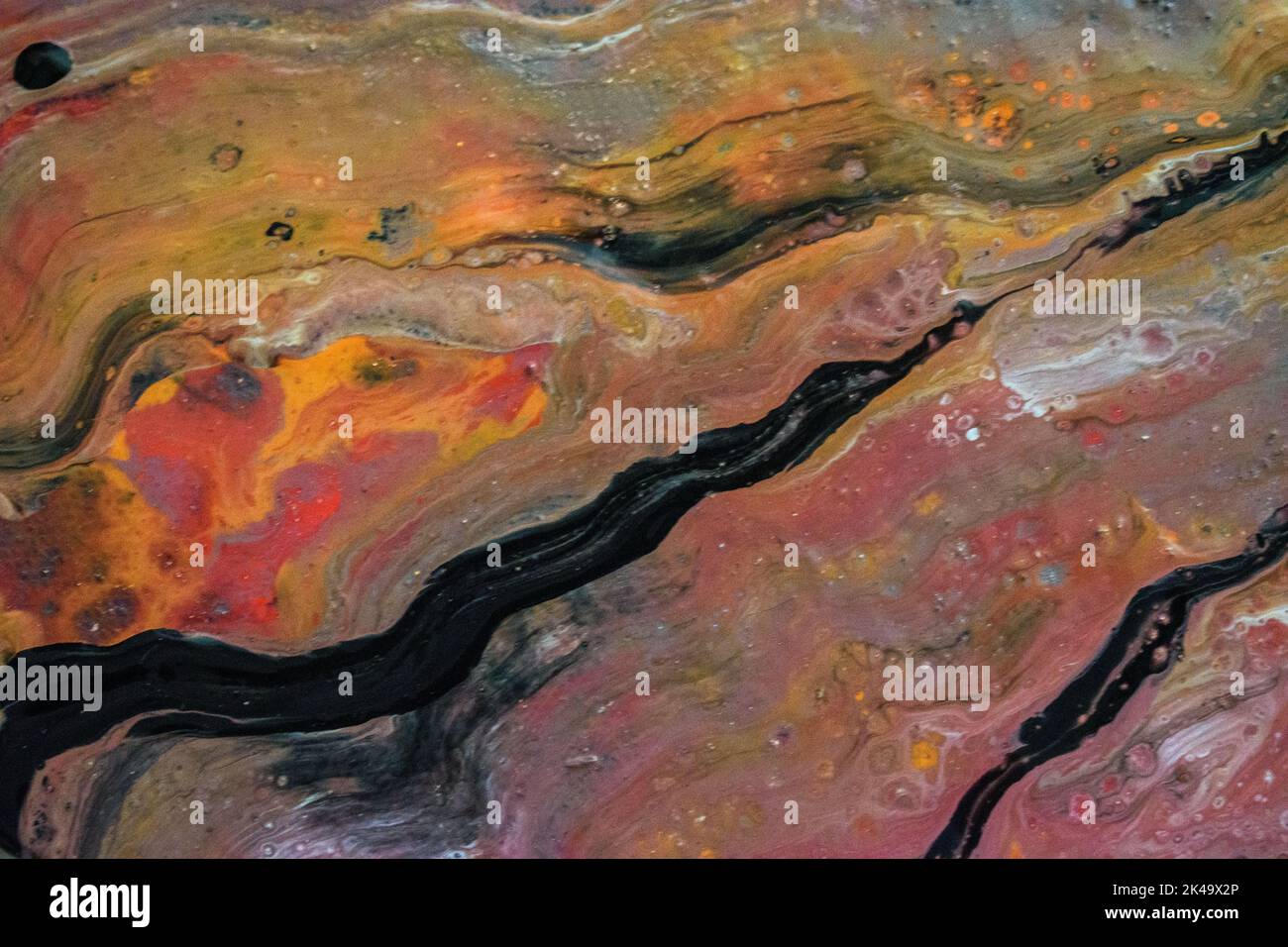 A closeup shot of a colorful marble paint surface background for ...