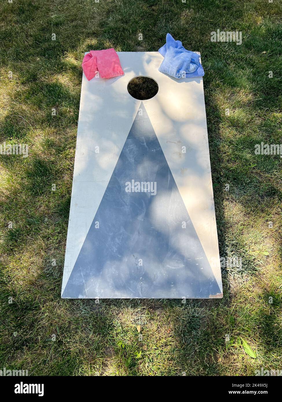 A Cornhole yard lawn game boards and bean bags Stock Photo - Alamy