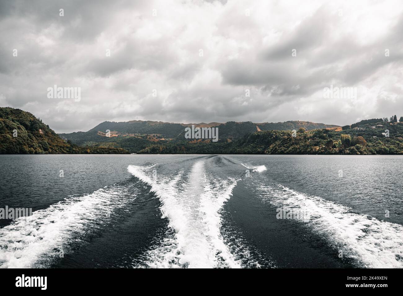 movement of lake water caused by the passage of a fast boat under a ...