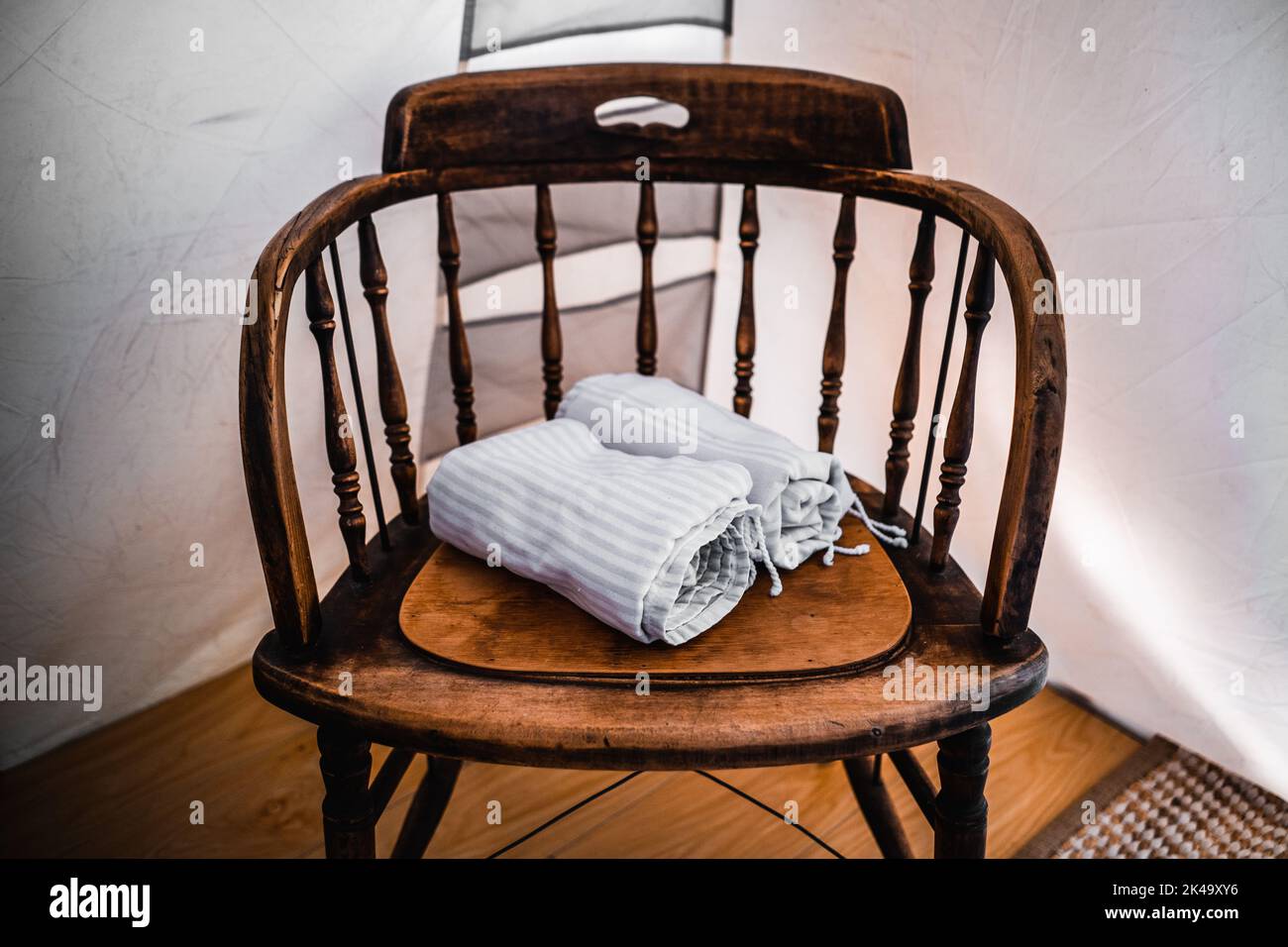 Rolled towel on chair hi-res stock photography and images - Alamy
