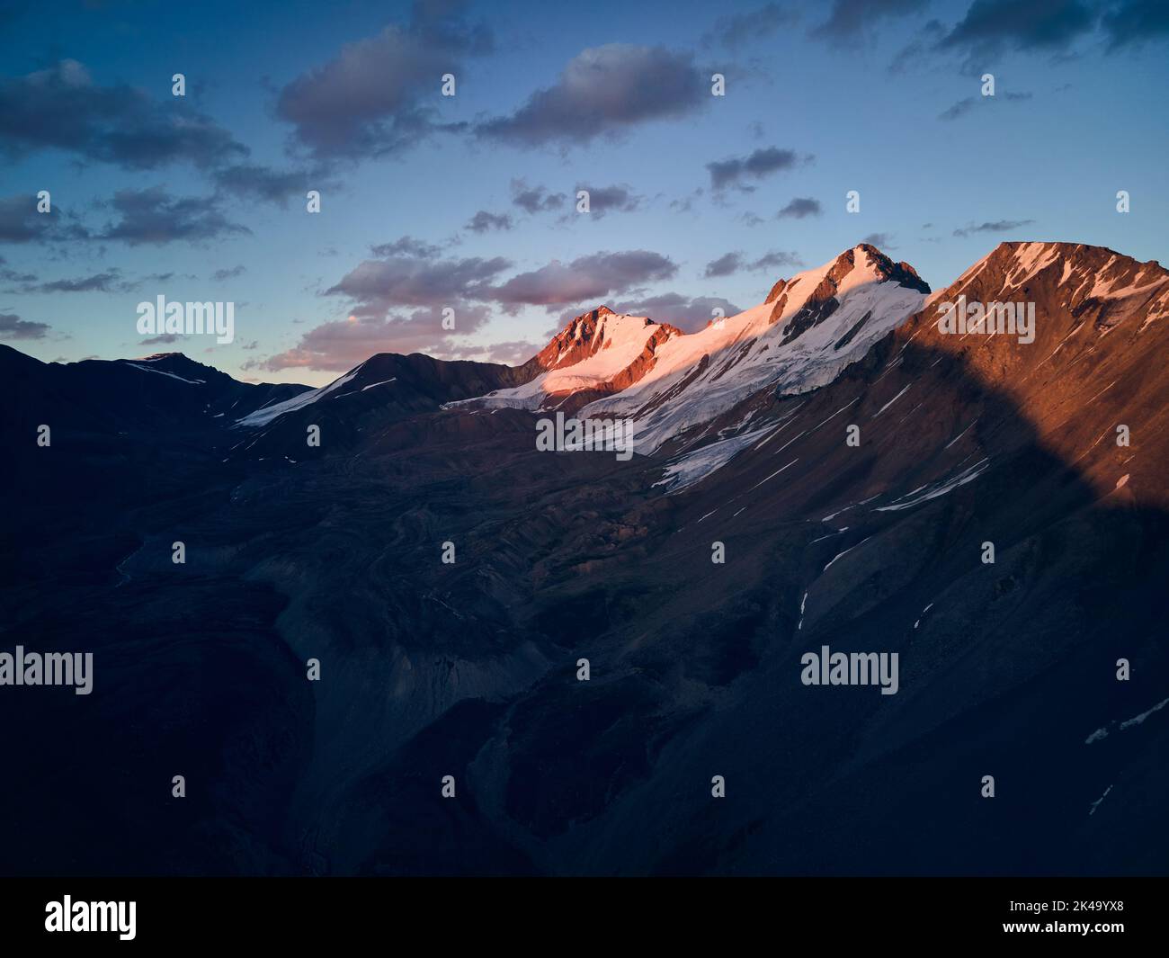 Beautiful scenery of the mountains with snow glacier silhouette at blue ...