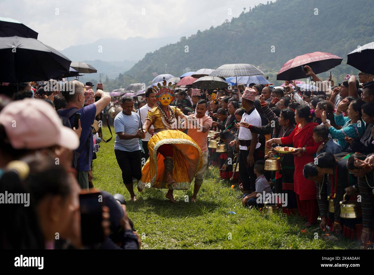 Kathmandu, Nepal. 1st Oct, 2022. A person with a cultural mask performs ...