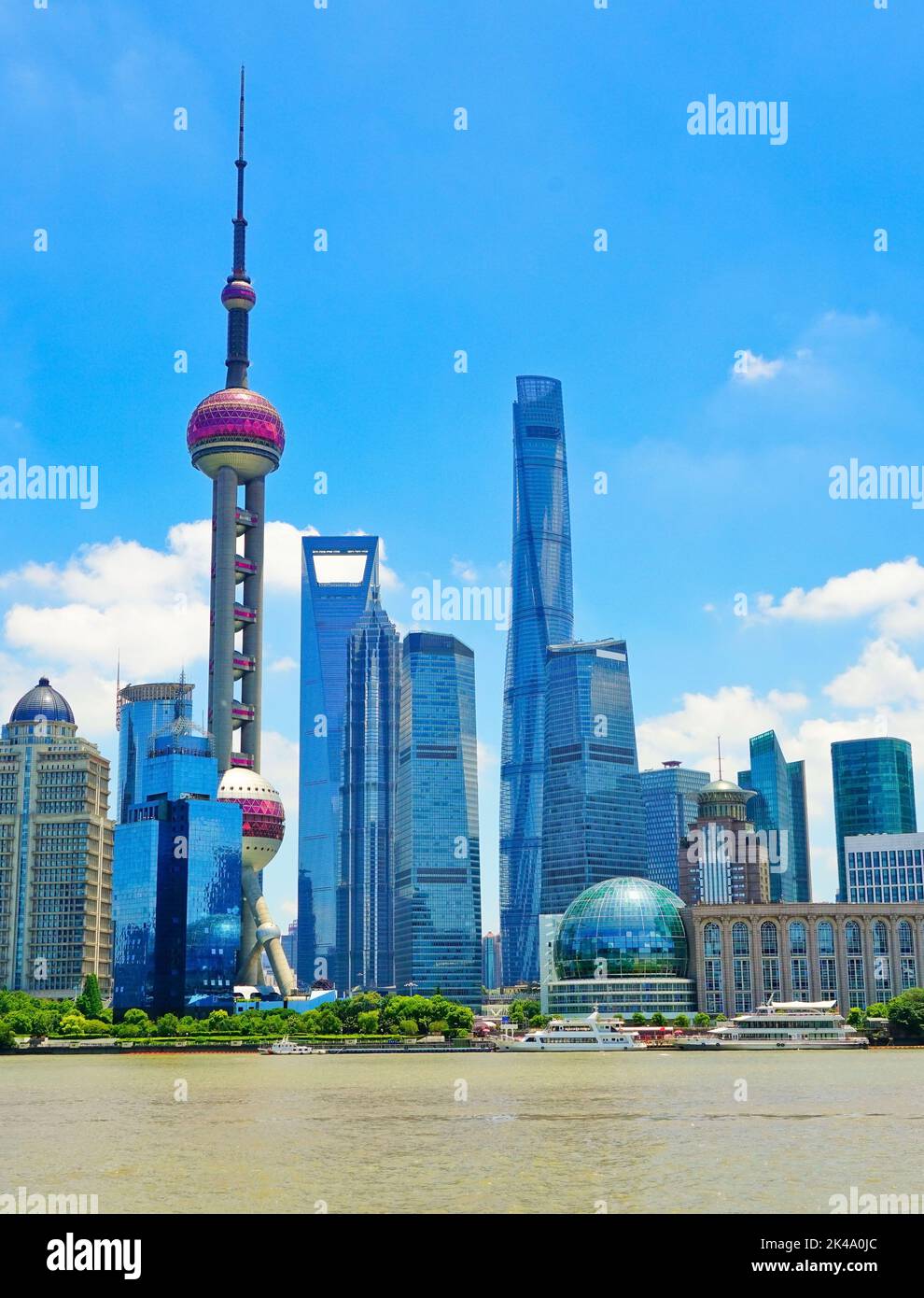 View of the skyline along the riverside on a sunny day in Shanghai ...