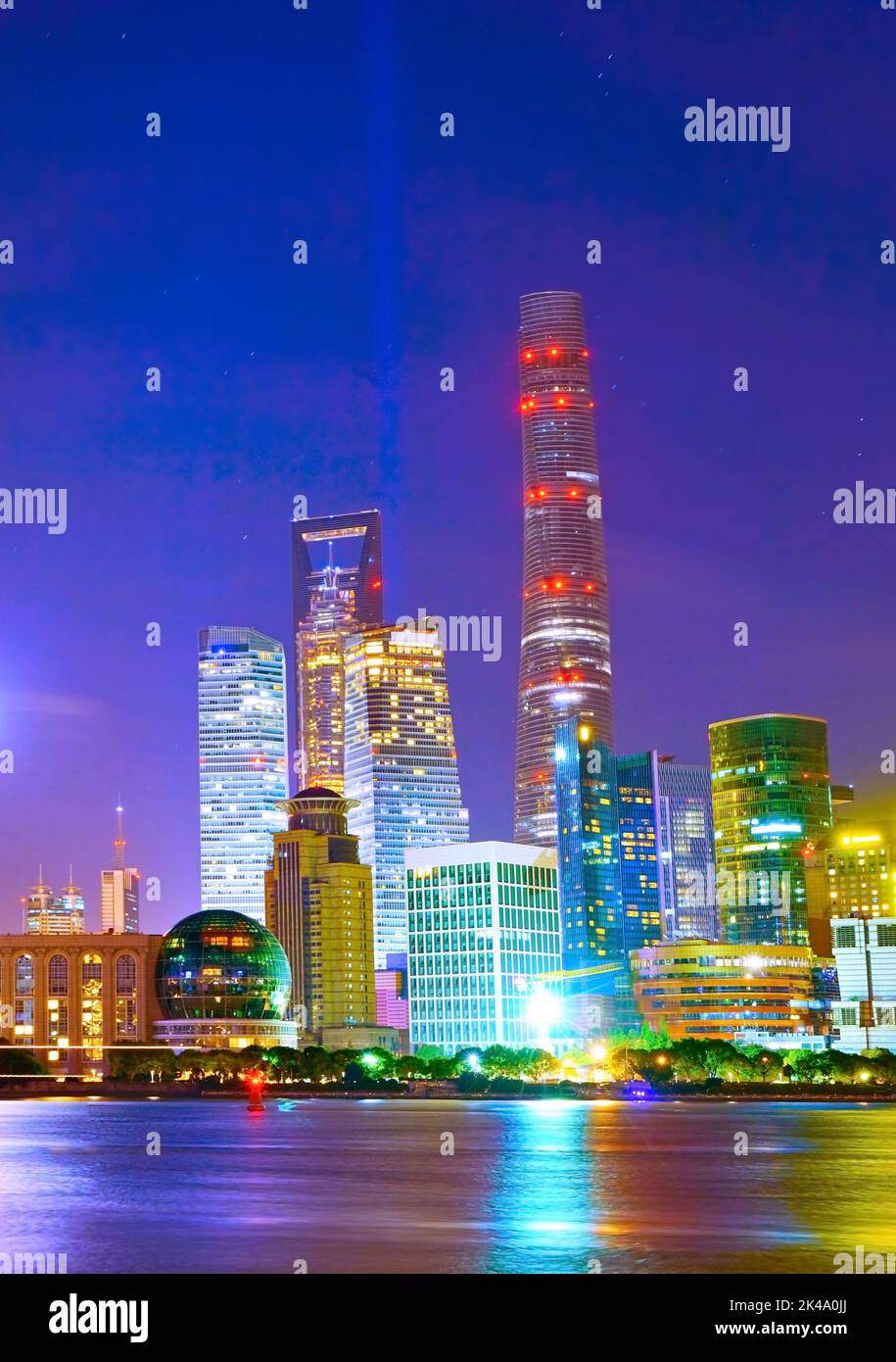 View of the skyline along the riverside at night in Shanghai, China ...