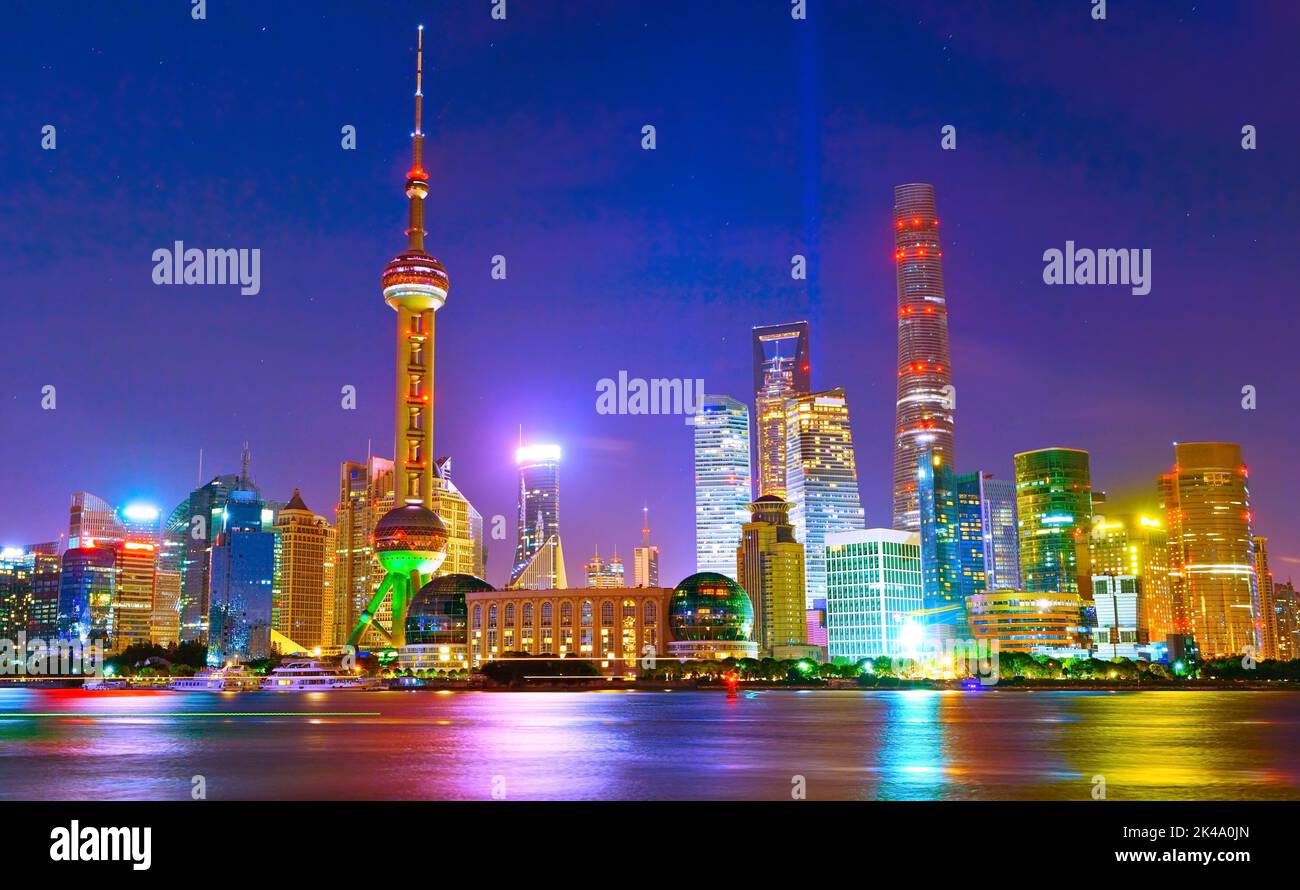 View of the skyline along the riverside at night in Shanghai, China ...