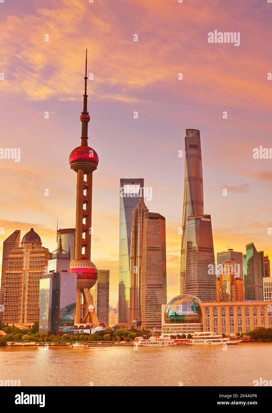 View of the skyline along the riverside at dusk in Shanghai, China ...