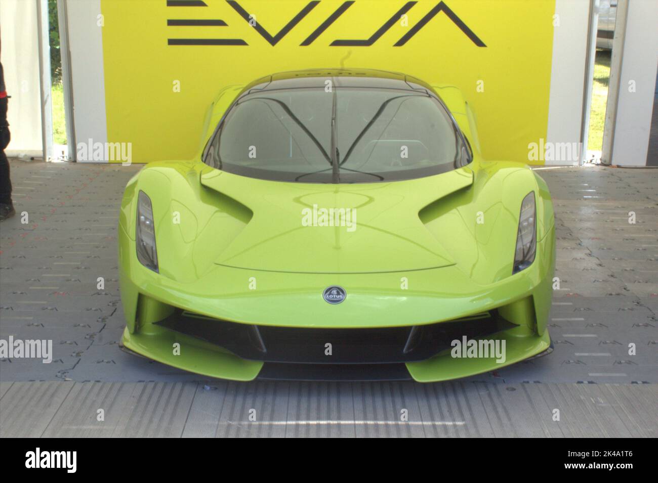 A neon green Lotus car on the Goodwood motor circuit festival Stock ...