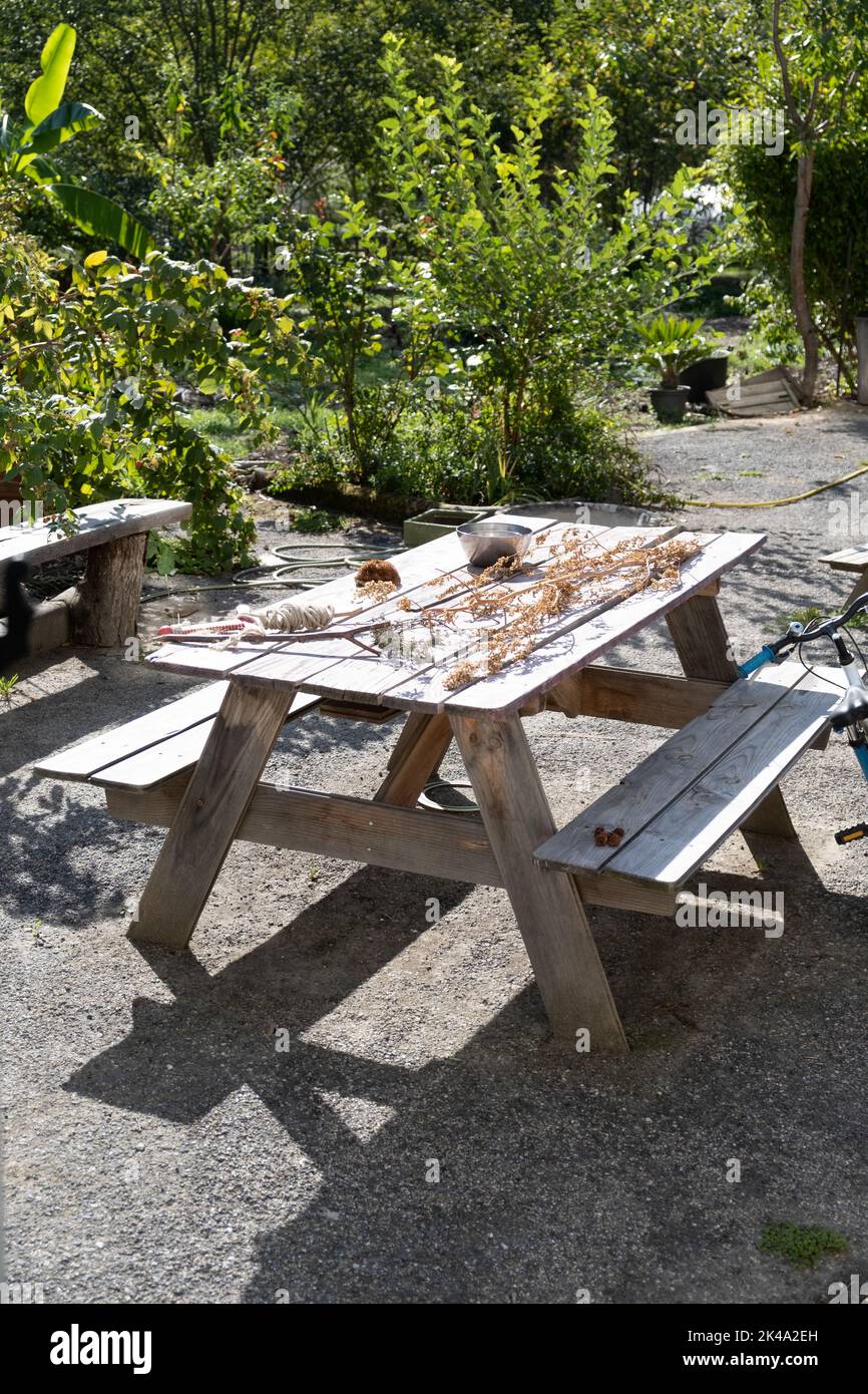 Wooden picnic table in a garden. Typical south french scene Stock Photo ...