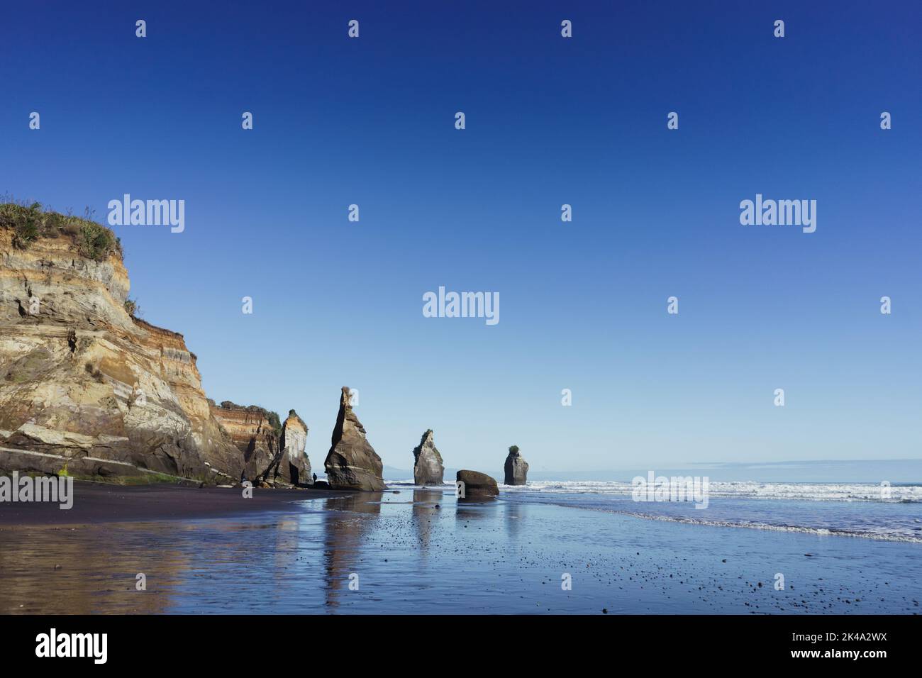 Isolated rocks in the ocean at the of the three sisters and the ...