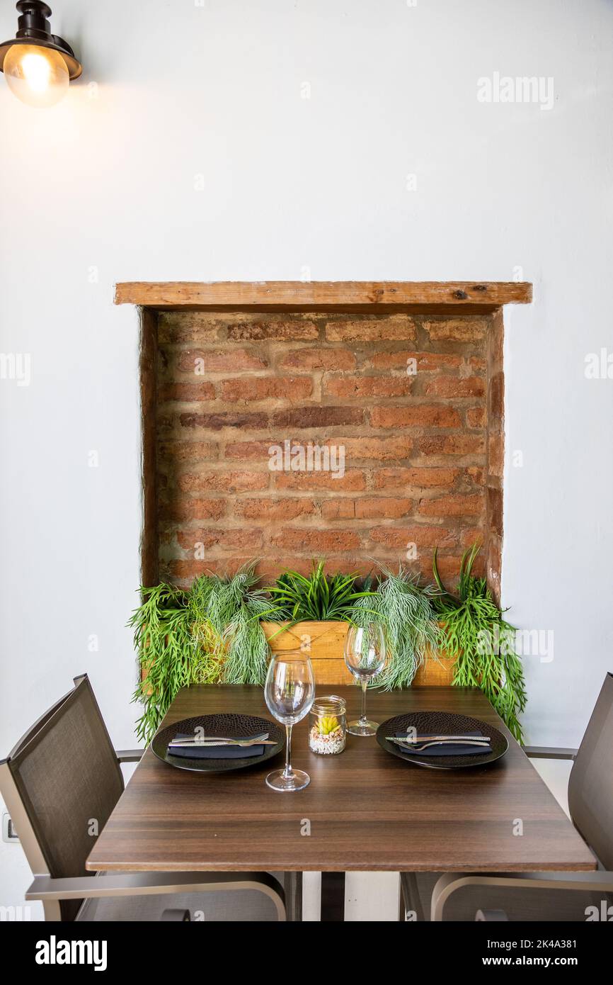 The interior of a restaurant with tables ready to be served Stock Photo ...