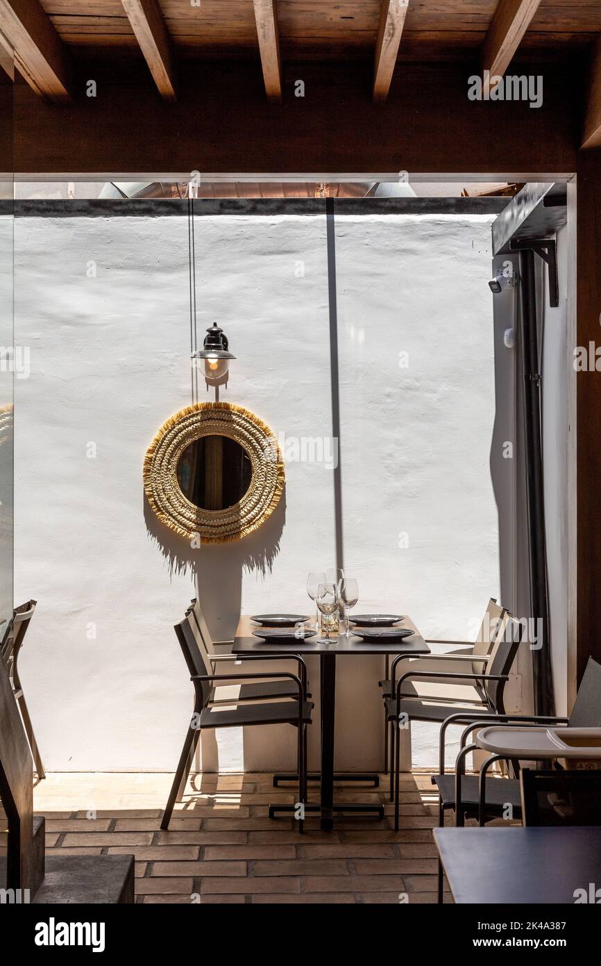 The interior of a restaurant with tables ready to be served Stock Photo ...