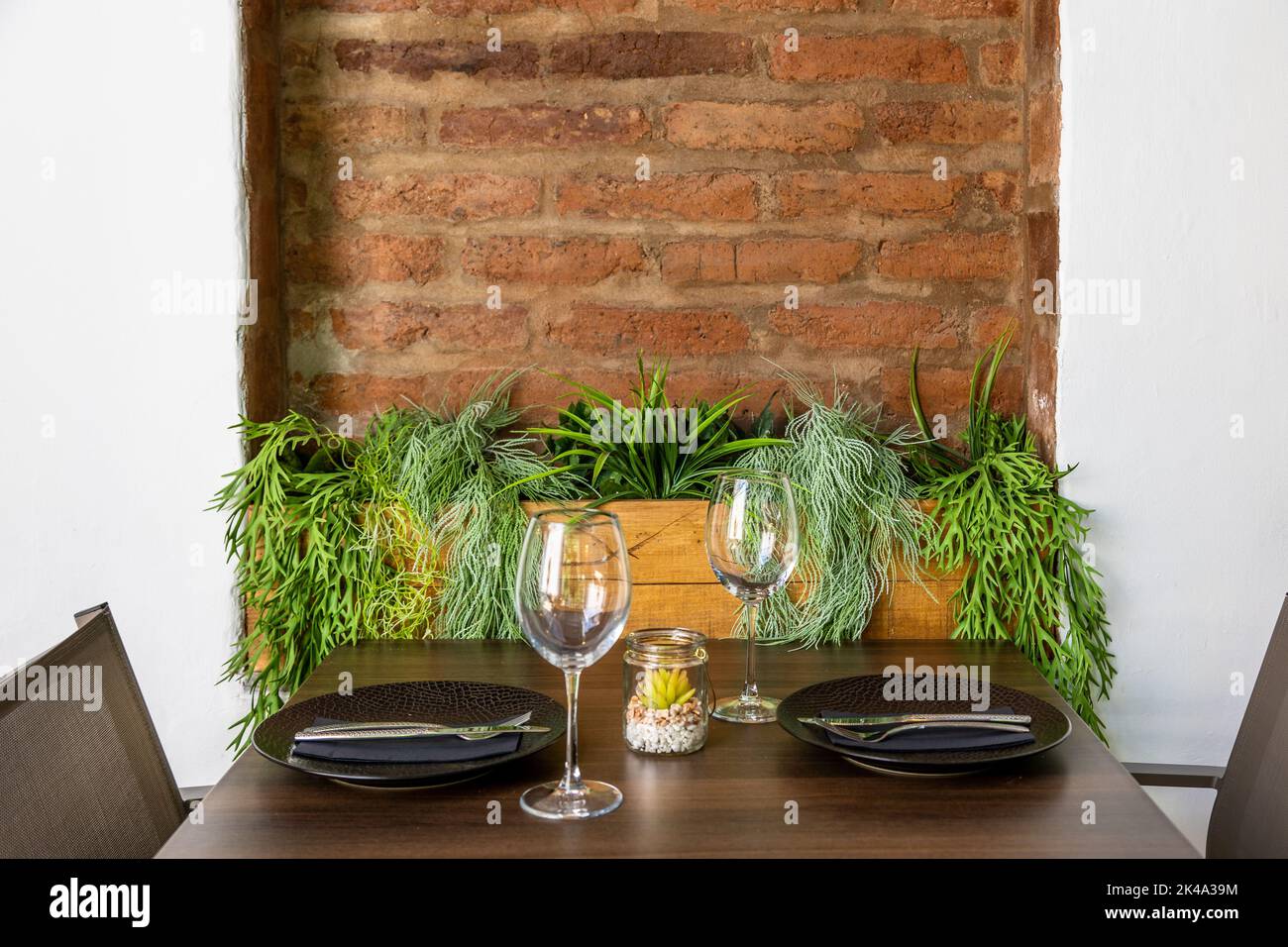 The interior of a restaurant with tables ready to be served Stock Photo ...