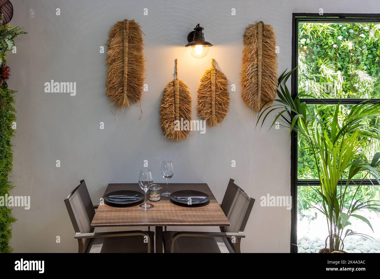 The interior of a restaurant with tables ready to be served Stock Photo ...