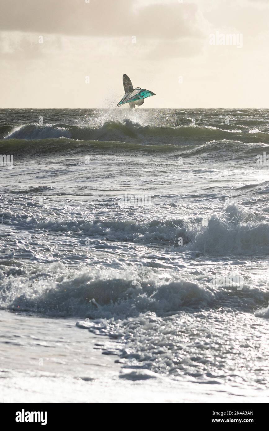 01 October 2022, Schleswig-Holstein, Westerland/Sylt: A windsurfer ...
