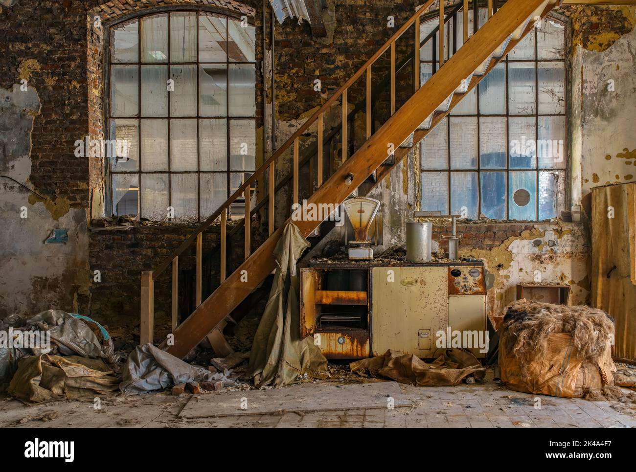An interior of an old abandoned manufacturing building with rusty ...