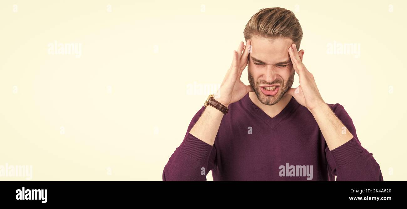 Distressed guy with closed eyes squeeze head with hands suffering from ...
