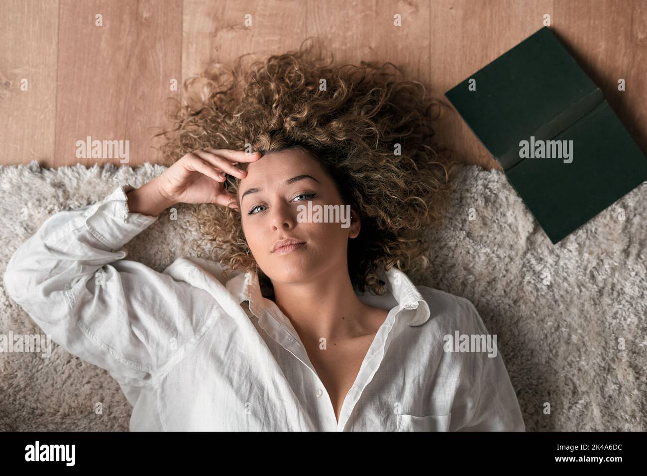 Young woman rest on floor hi-res stock photography and images - Alamy