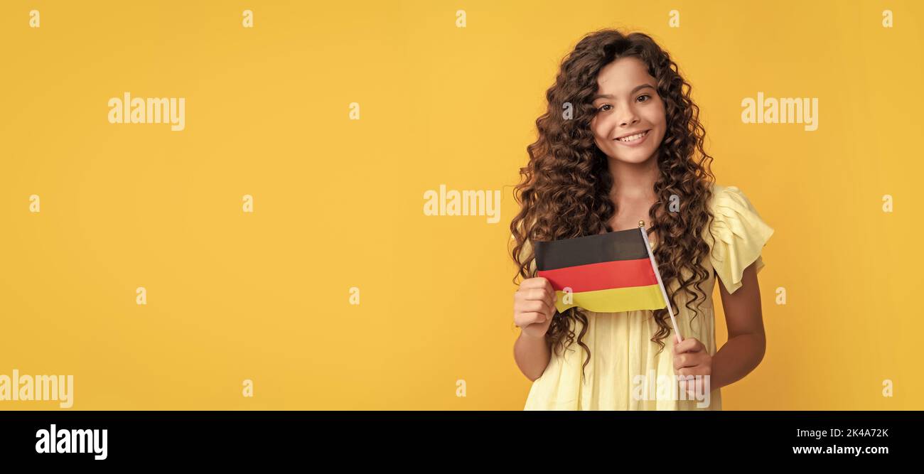 smiling kid long curly hair hold german flag, germany. Horizontal ...