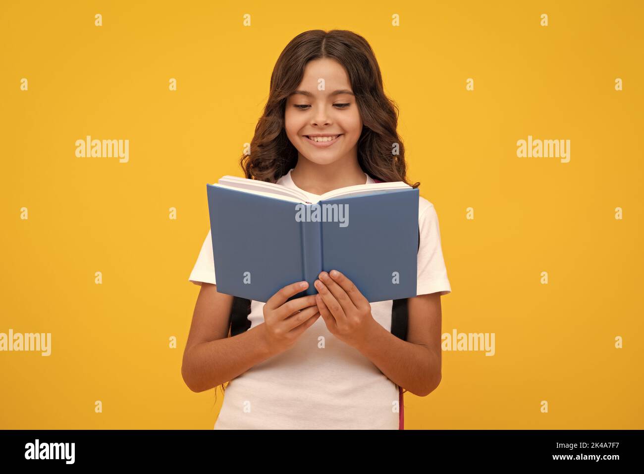 Back to school. Teenager school girl hold book and copybook ready to ...