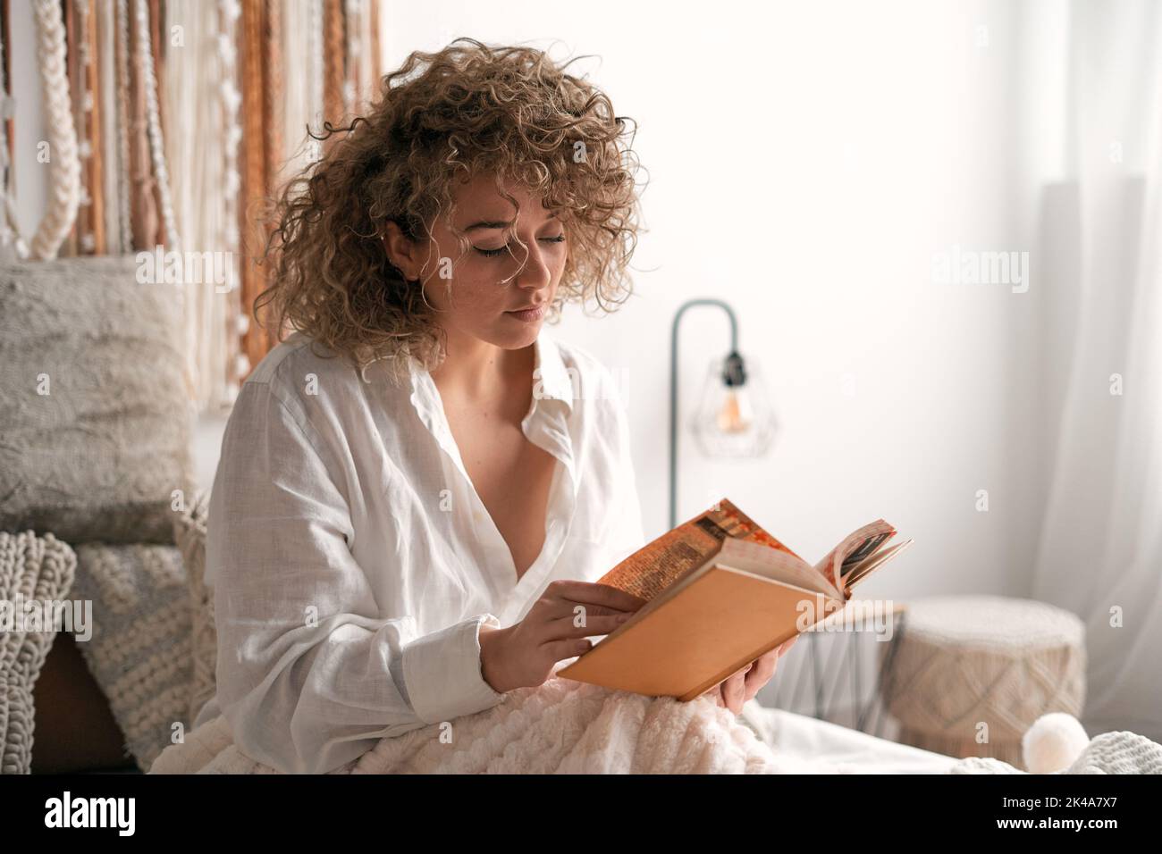 Young female read interesting hi-res stock photography and images - Alamy