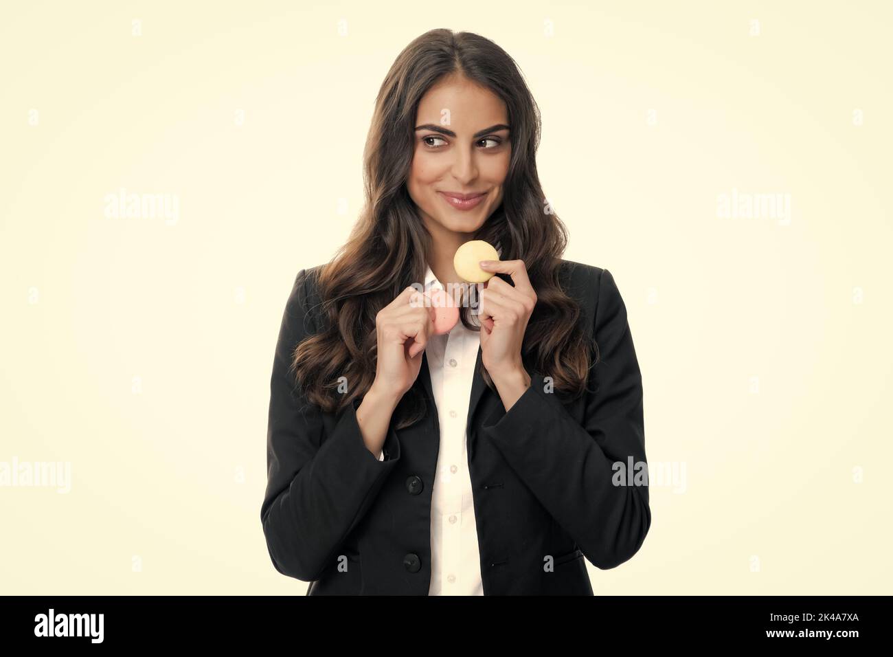 Young pleased woman isolated over white isolated background eating ...