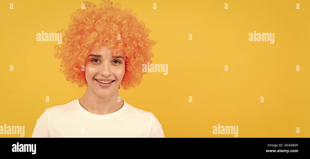 happy freaky woman in curly clown wig for party, fun. Woman isolated ...