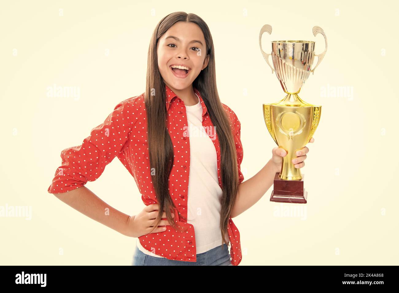 Teenage girl holding a trophy. Kid winner child won the competition ...