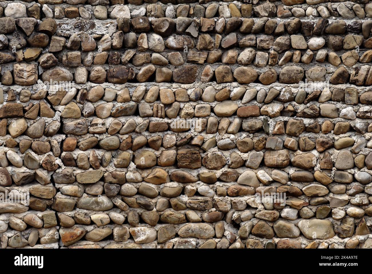 Texture of the wall built of round pebbles in Signagi fortress in ...