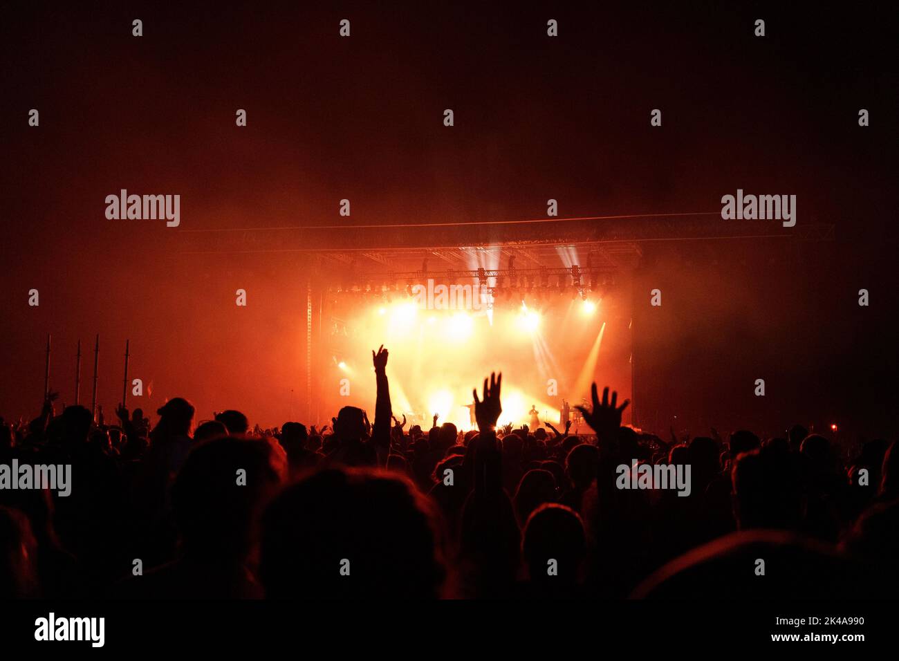 A beautiful shot of a crowd of dancing people near an outdoor ...
