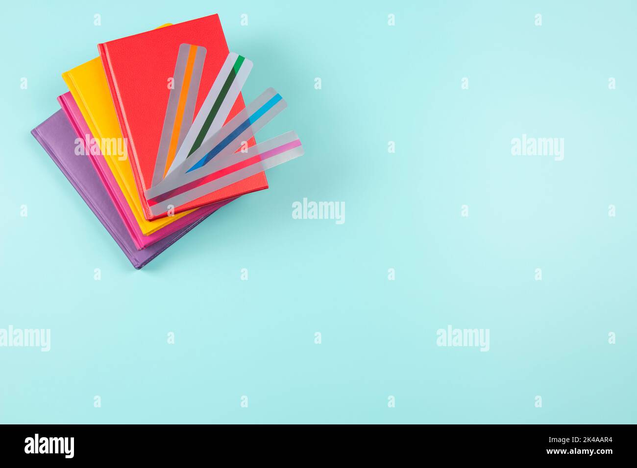 Dyslexia. Top view to red book with colorful reading highlight bookmark ...