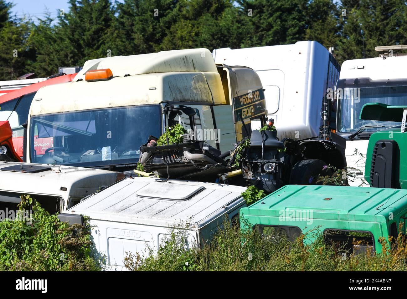 heavy goods vehicles in a scrapyard Stock Photo - Alamy