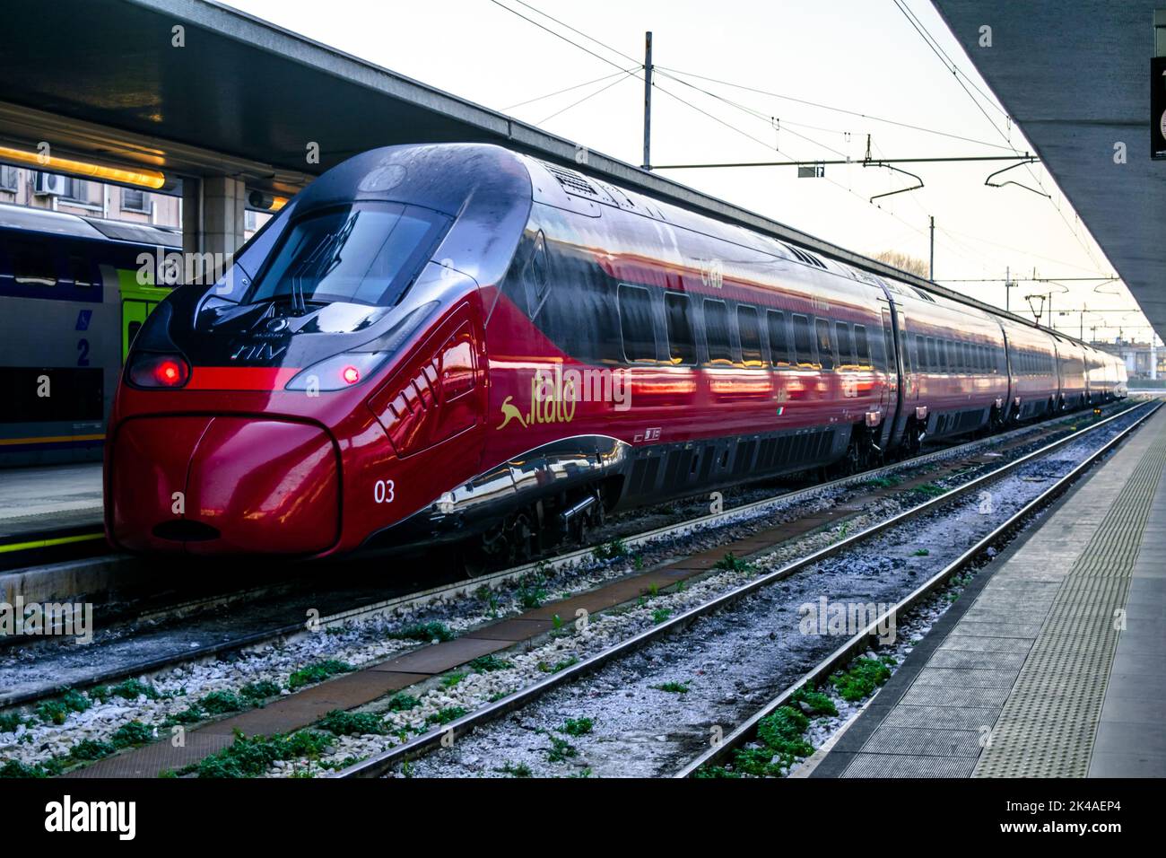 A red Fast passenger bullet train in Milan in the train station ...
