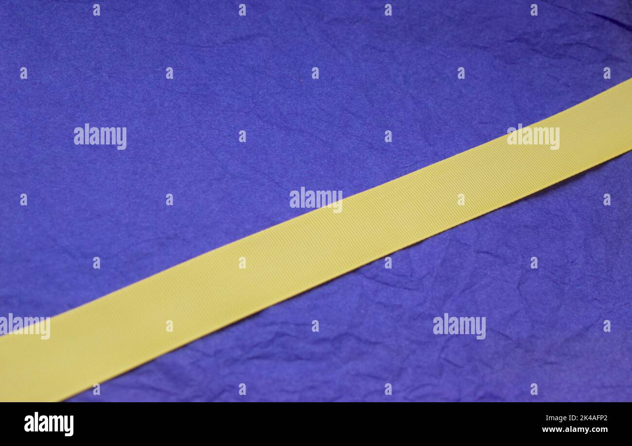 Gift packaging with yellow ribbon Stock Photo - Alamy