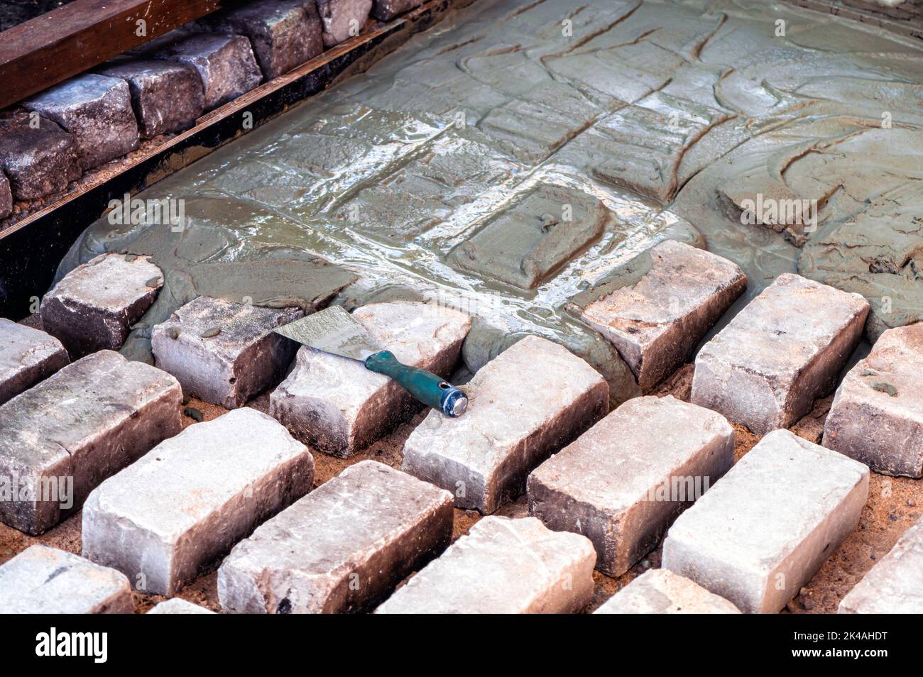concreting the foundation of the garden terrace floor, trowel on the ...