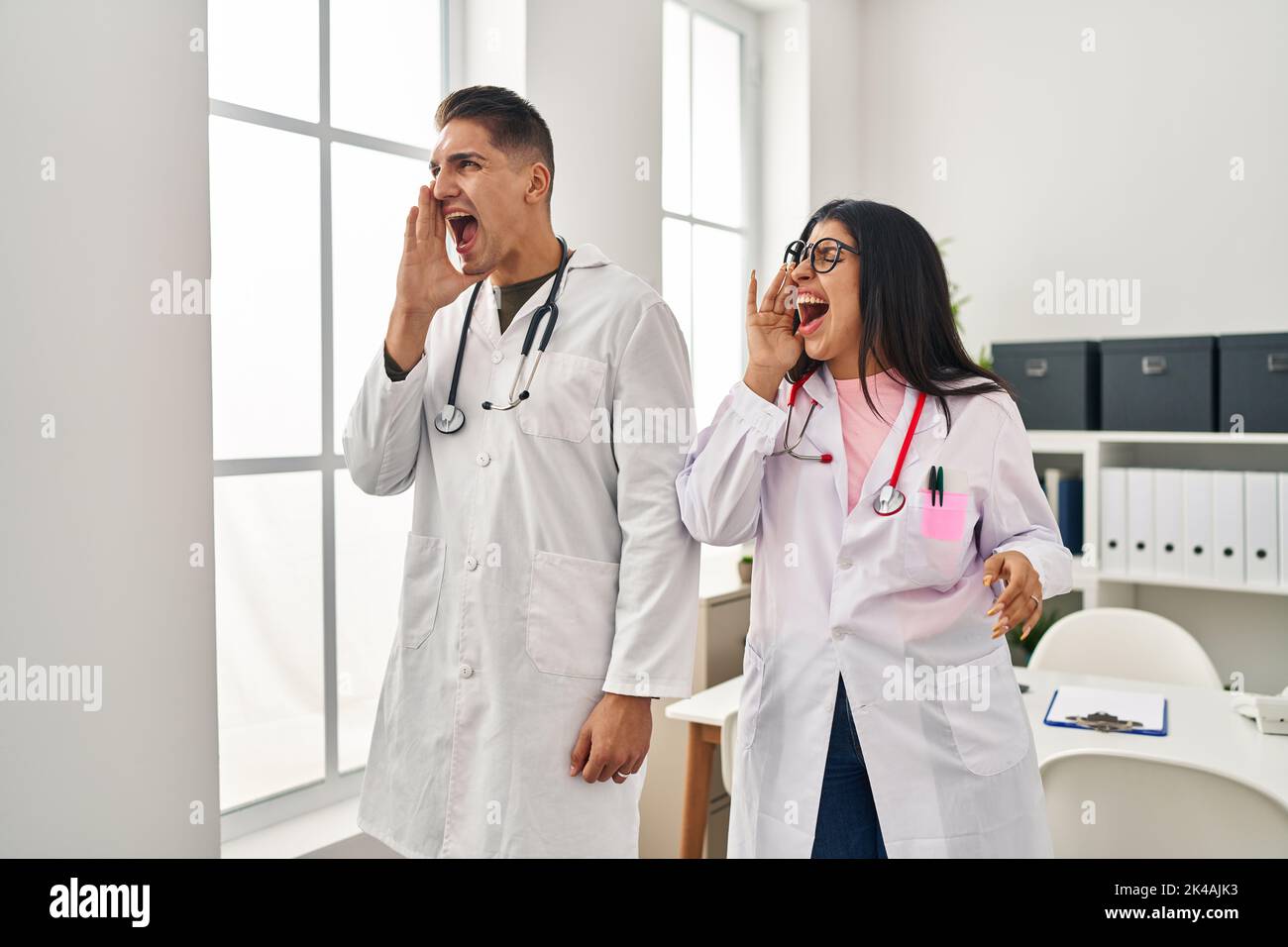 Young doctors wearing uniform and stethoscope at the clinic clueless ...